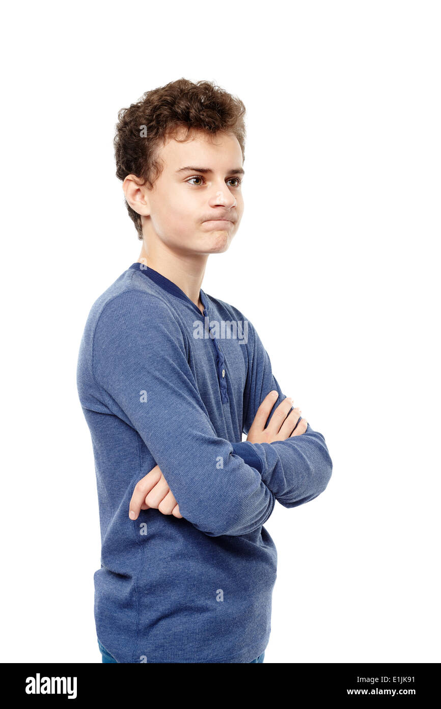 Studio shot of teenager with arms folded showing disappointment ...