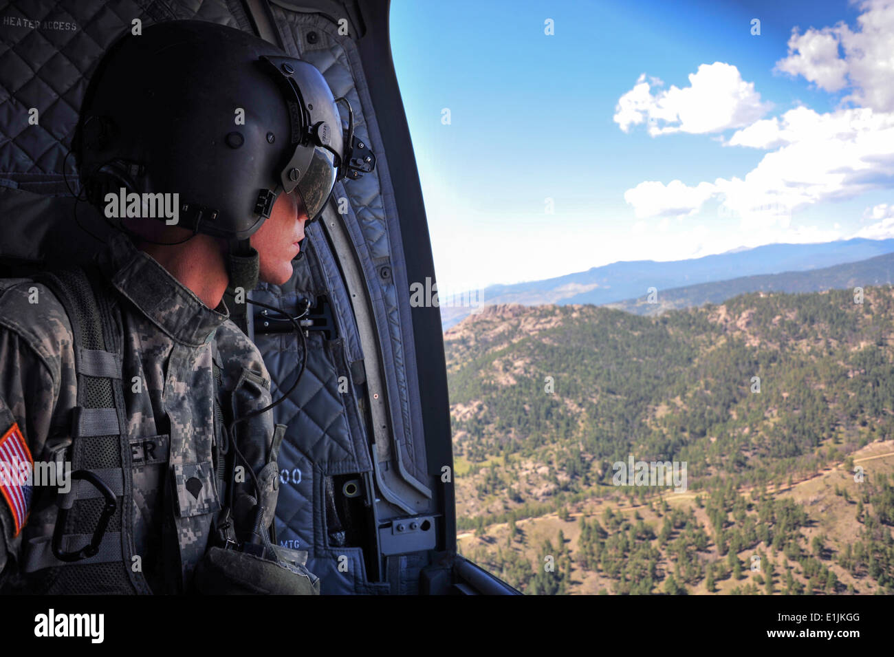 U.S. Army Pvt. Ben Stocker, a CH-47 Chinook helicopter crew chief with ...