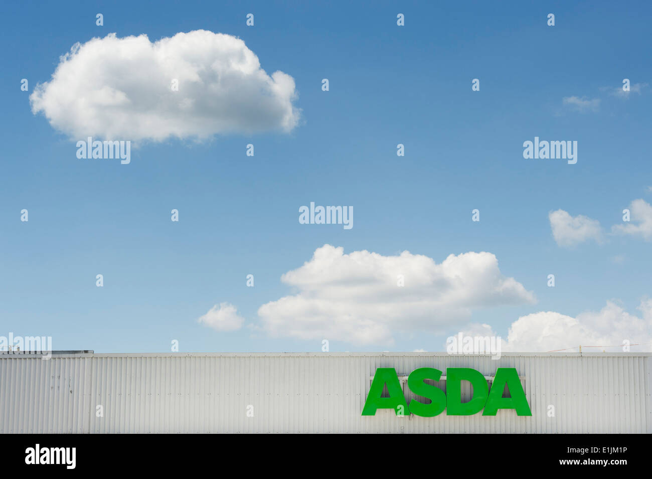 ASDA sign on superstore with blue cloudy sky Stock Photo - Alamy