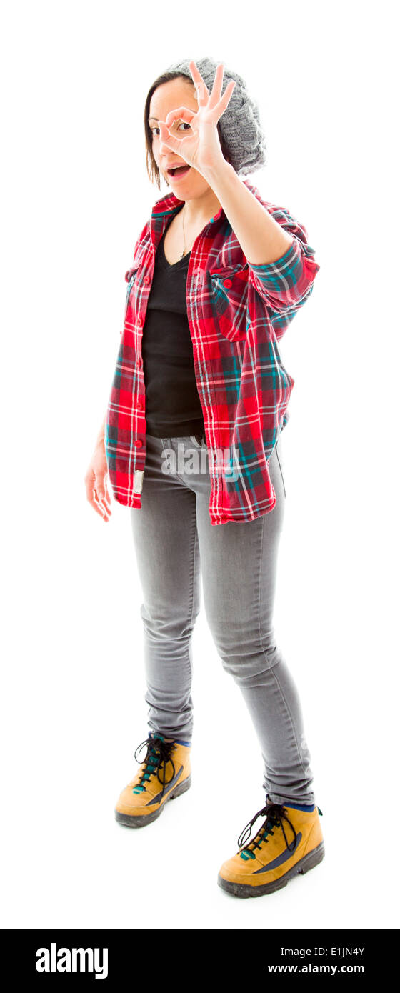 Young woman looking through fingers, making 'ok' sign Stock Photo - Alamy