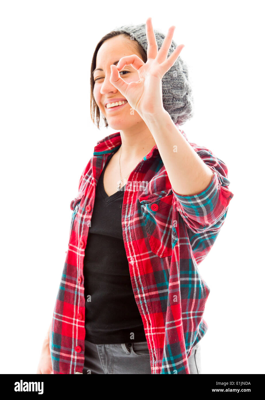 Young woman looking through fingers, making 'ok' sign Stock Photo - Alamy