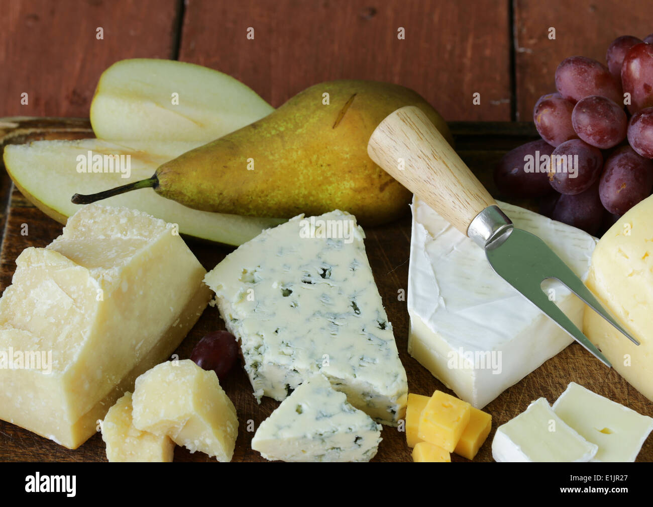 cheeseboard with assorted cheeses (parmesan, brie, blue, cheddar Stock ...