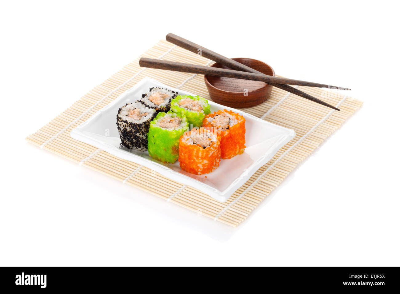 Sushi maki on bamboo mat. Isolated on white background Stock Photo - Alamy