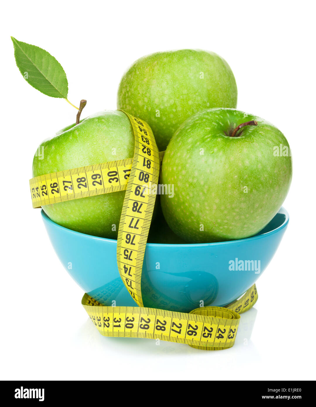 Fresh green apples with yellow measuring tape. Isolated on white ...