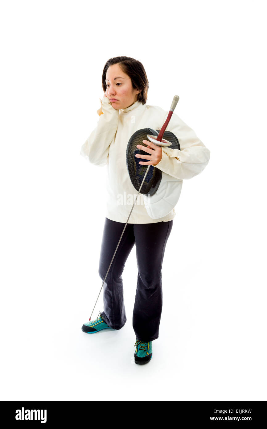 Female fencer looking sad with a holding mask and sword Stock Photo - Alamy
