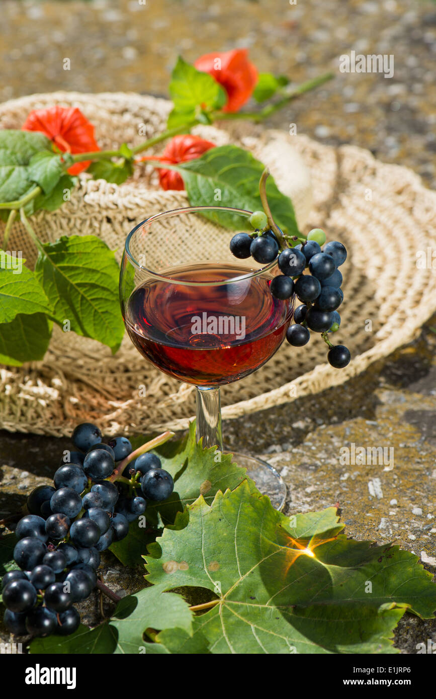 Glass of wine and rose leaves hi-res stock photography and images - Alamy