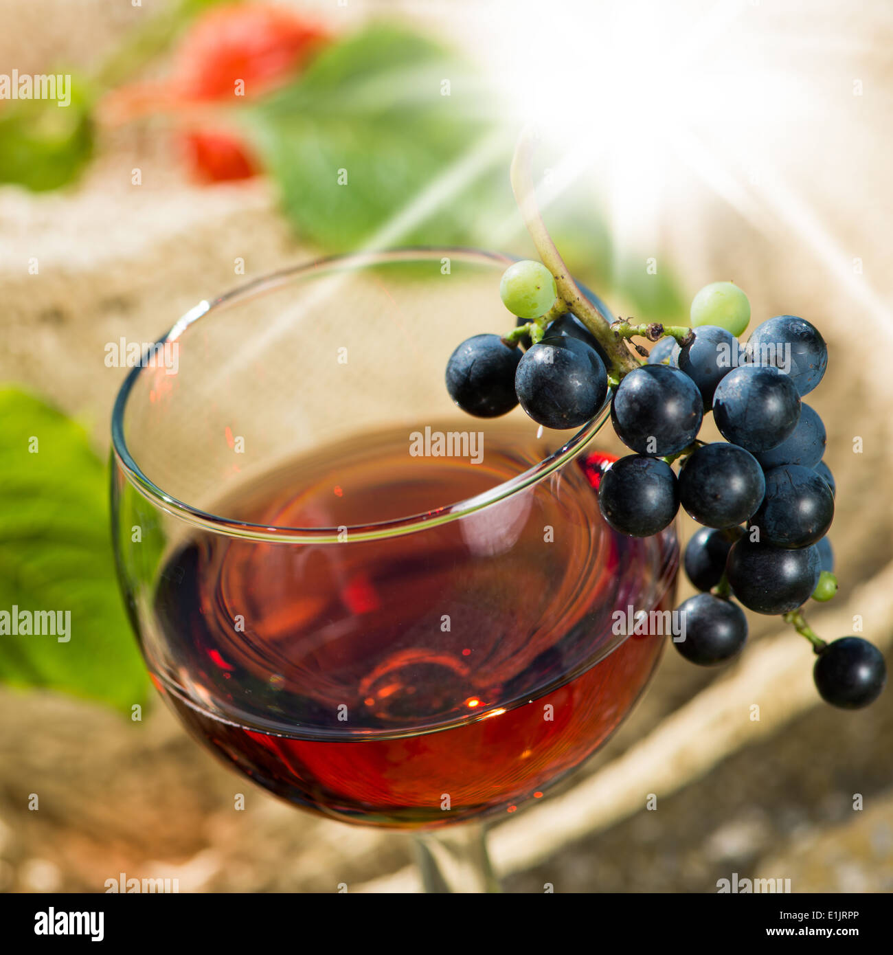 Rosé wine with fresh grapes Stock Photo - Alamy