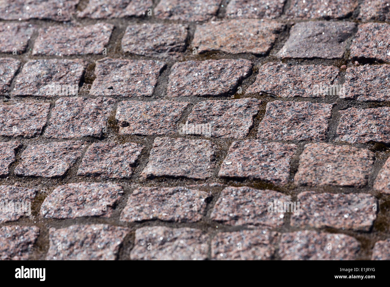 Granite stone road texture as a background Stock Photo - Alamy