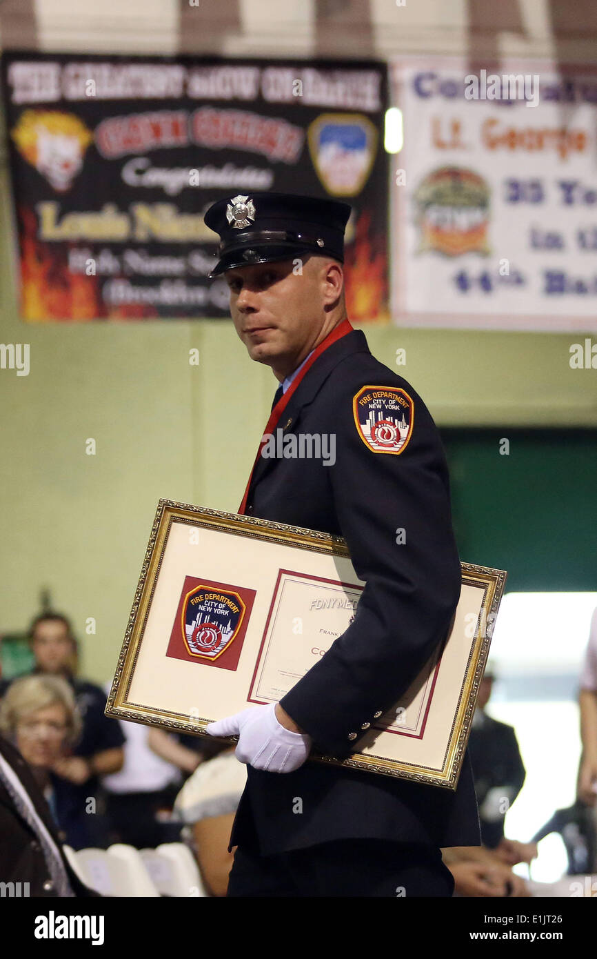New York, New York, USA. 4th June, 2014. Firefighter CODY J. BAKER of Ladder Company 59 is ...
