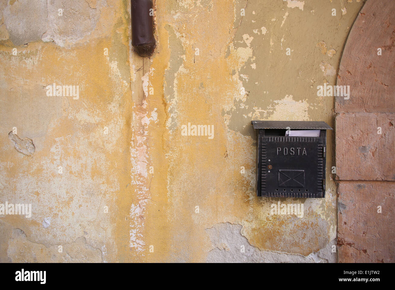 Yellow post box on wall hi-res stock photography and images - Alamy