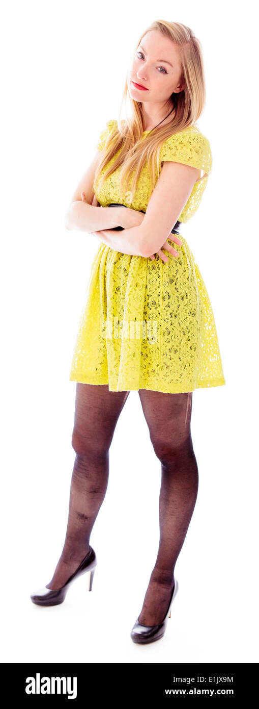 Beautiful young woman standing with her arms crossed Stock Photo - Alamy