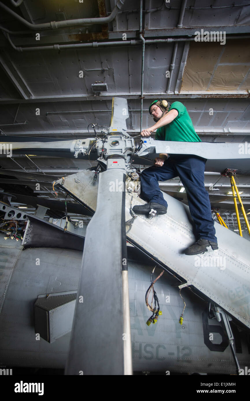 U.S. Navy Aviation Machinist's Mate 2nd Class Bryan Myers performs ...