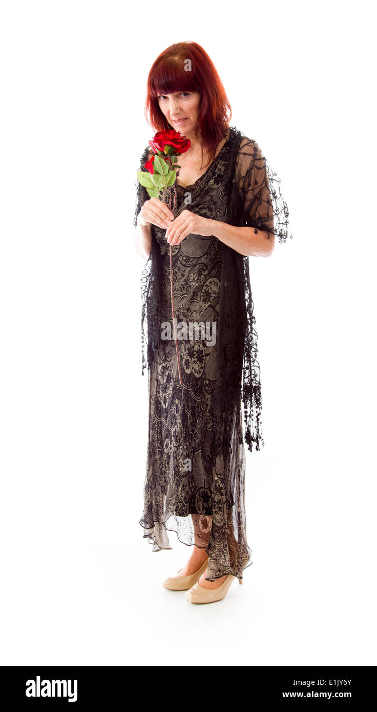 Mature woman bad smelling red rose isolated on a white background Stock ...