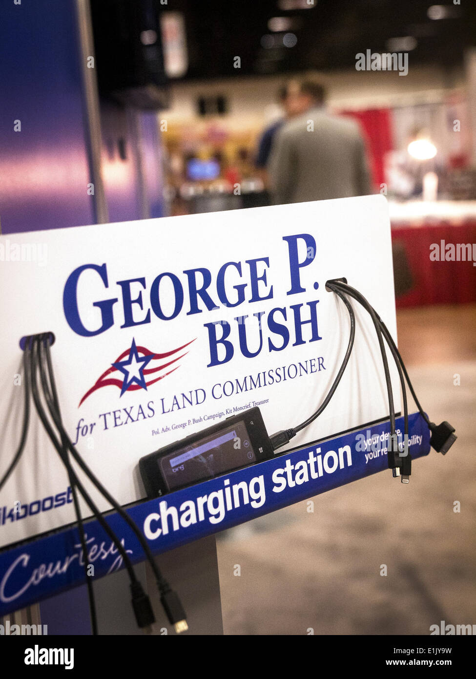 Ft, Worth, Texas, USA. 5th June 2014. While their cell phone charges ...