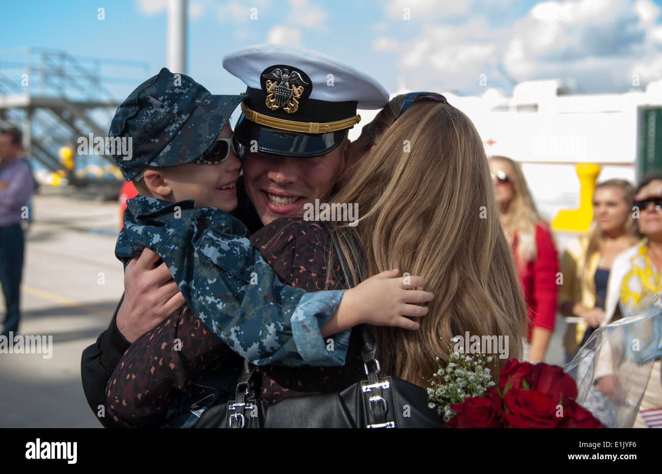 A U.S. Sailor reunites with his family at Naval Station San Diego ...