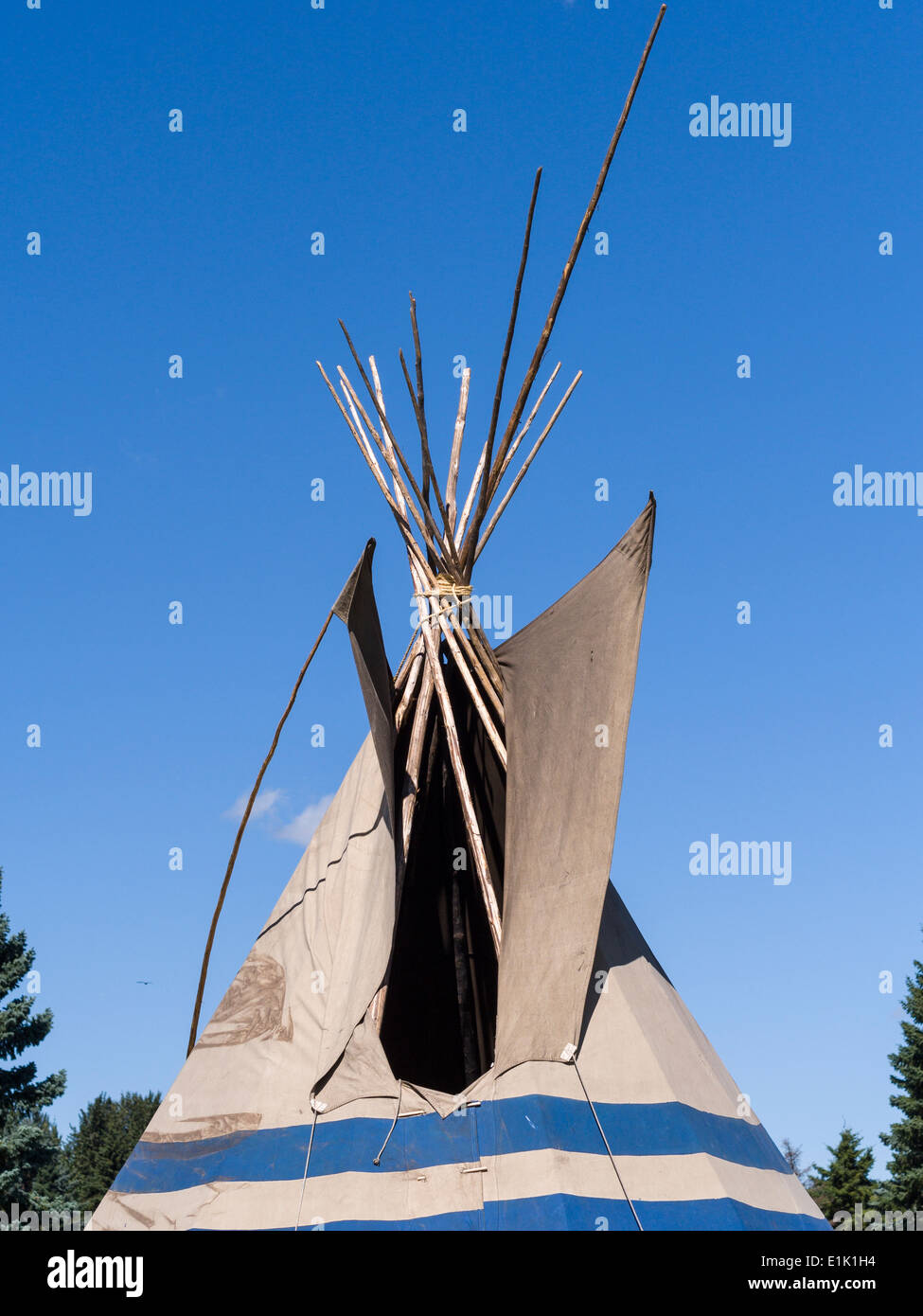 Teepee vent hole for smoke. The top of a canvas covered native tipi ...