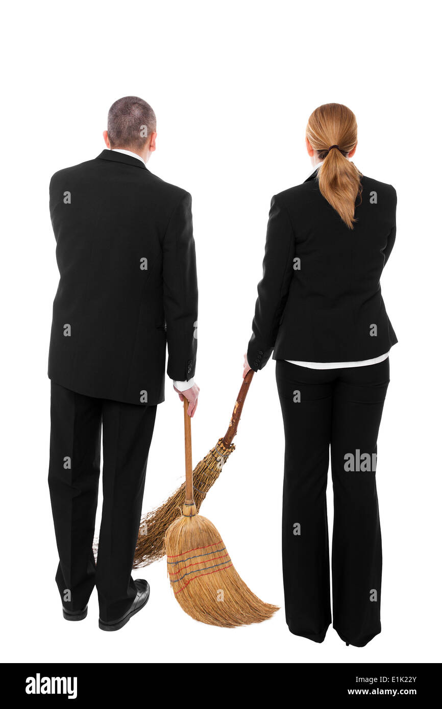 two business people with brooms making a inappropriate working Stock ...