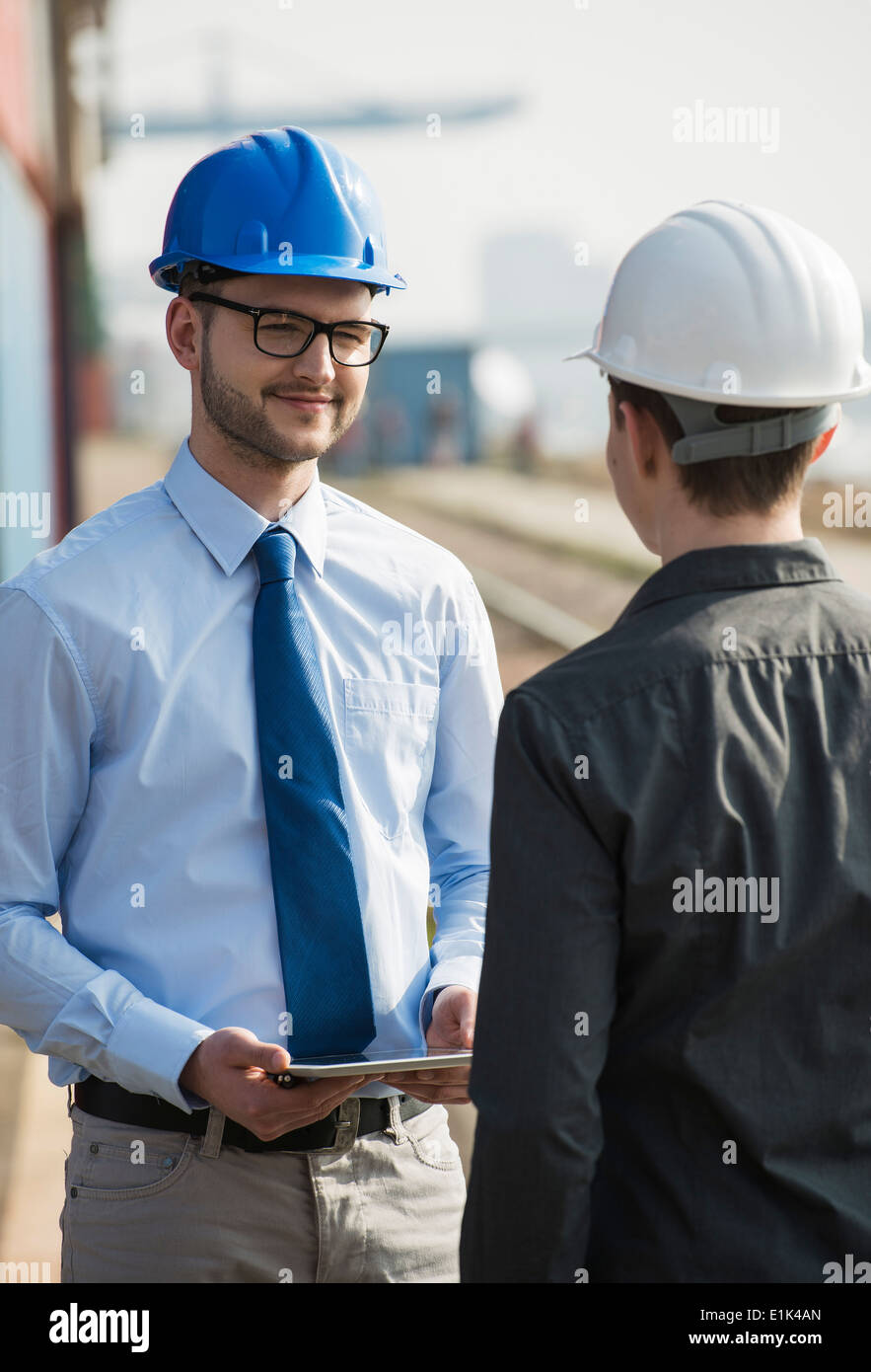 Businessman talking teenager container terminal hi-res stock ...