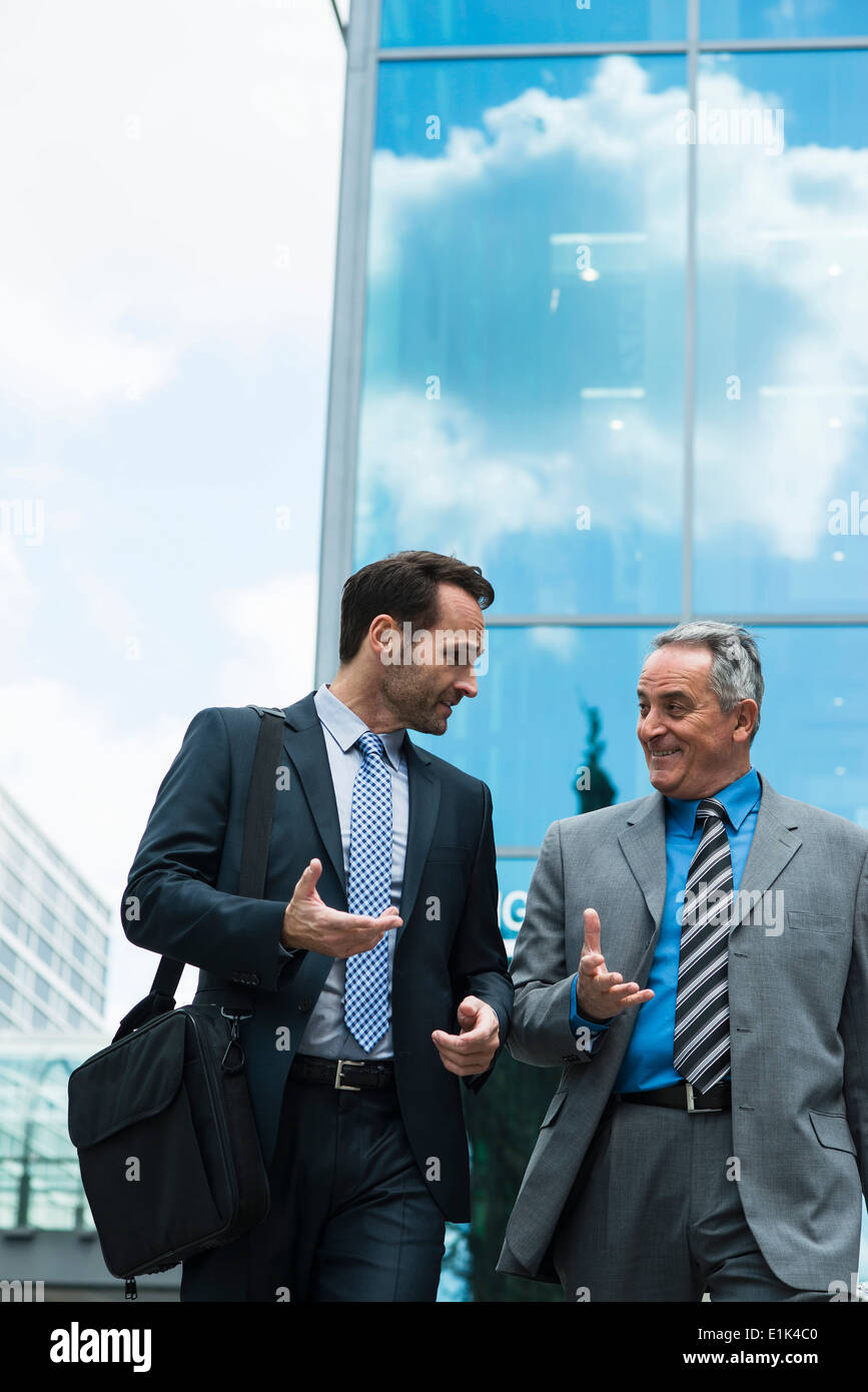 Two businessmen talking outdoors Stock Photo - Alamy