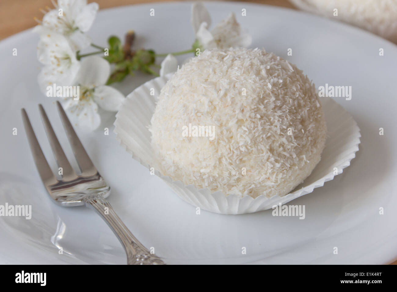 Snowball pastry on white plate Stock Photo - Alamy
