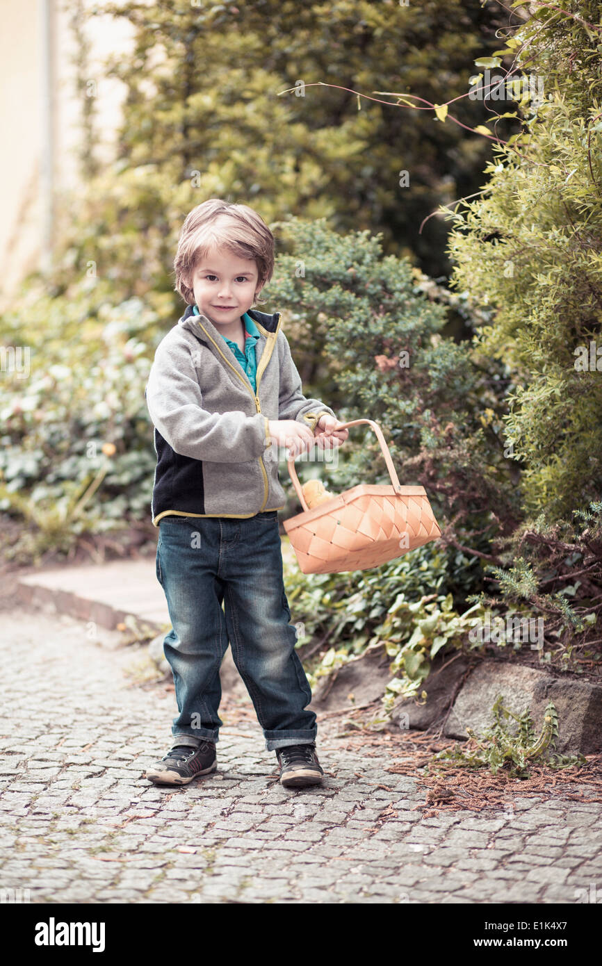Little boy with basket on the move Stock Photo - Alamy