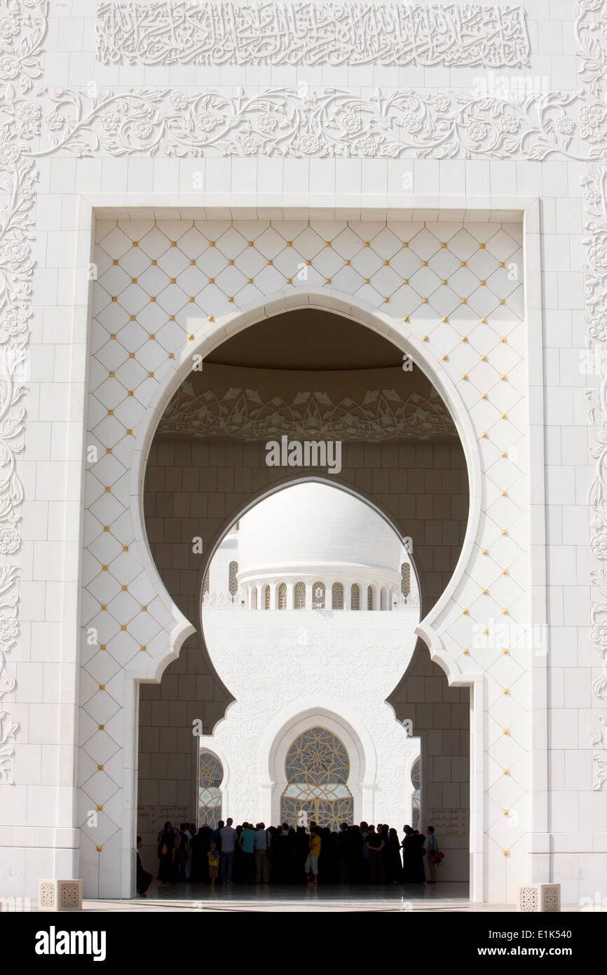 Sheikh Zayed Grand Mosque. The main entrance is inlaid with text from ...