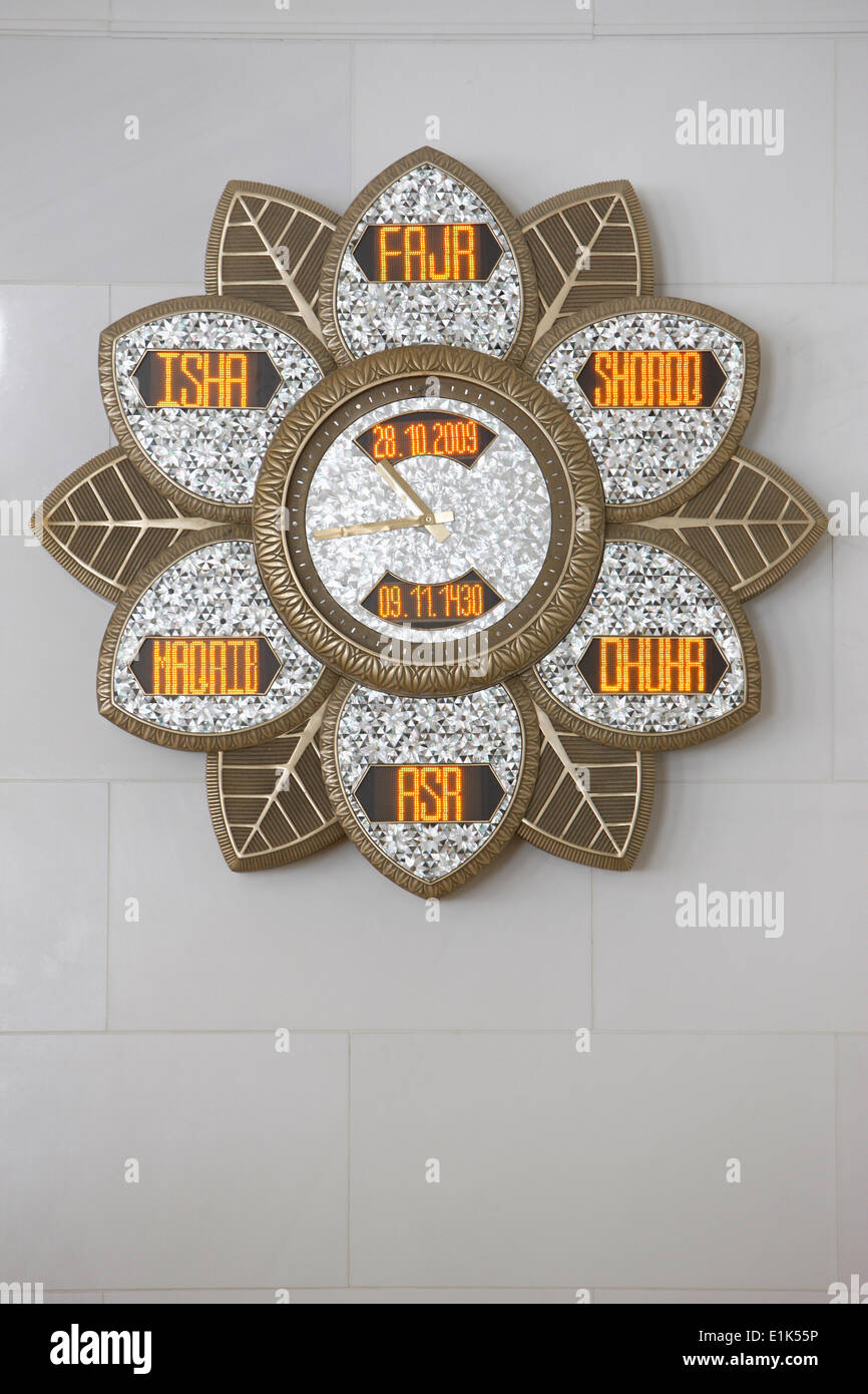Sheikh Zayed Grand Mosque. Clocks indicating prayer times Stock Photo ...