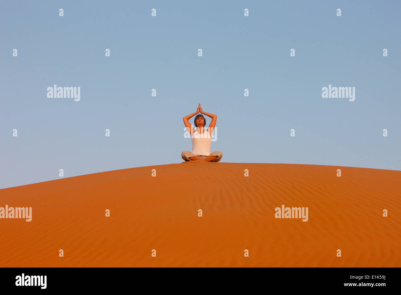 Meditation in the desert Stock Photo - Alamy