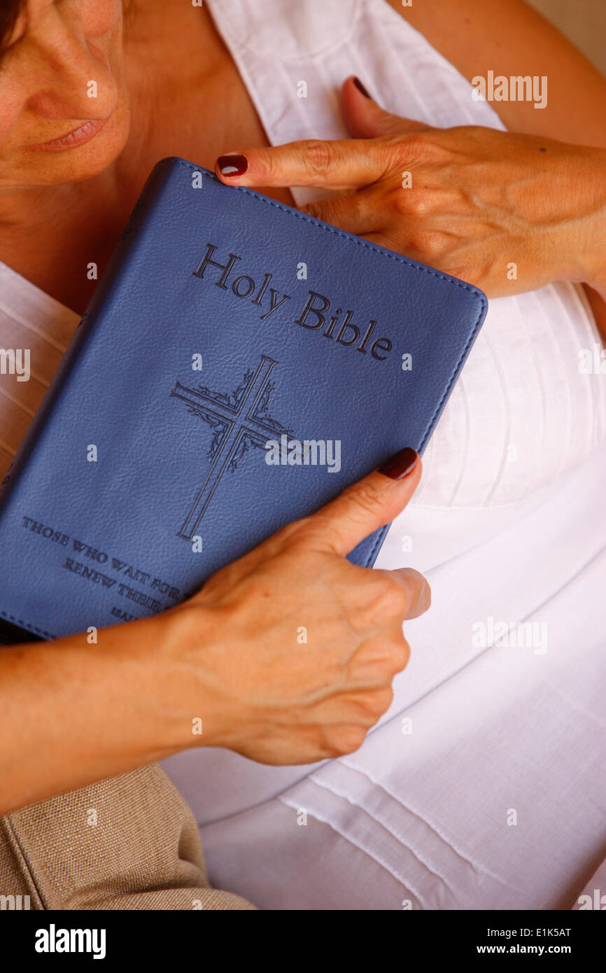 Woman holding bible hi-res stock photography and images - Alamy