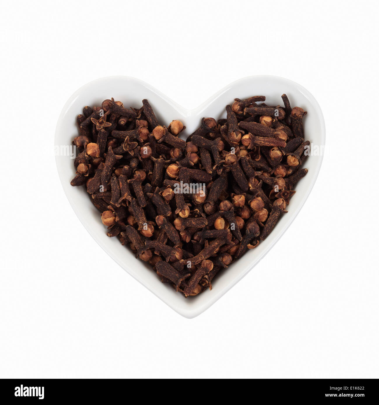 Cloves in a heart-shaped dish Stock Photo - Alamy