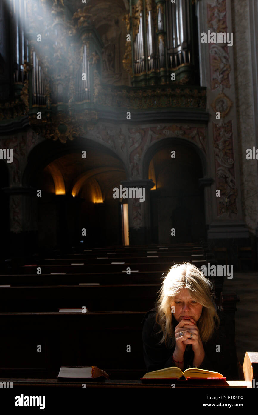 The baroque church of the abbey of Herzogenburg. Woman reading the ...