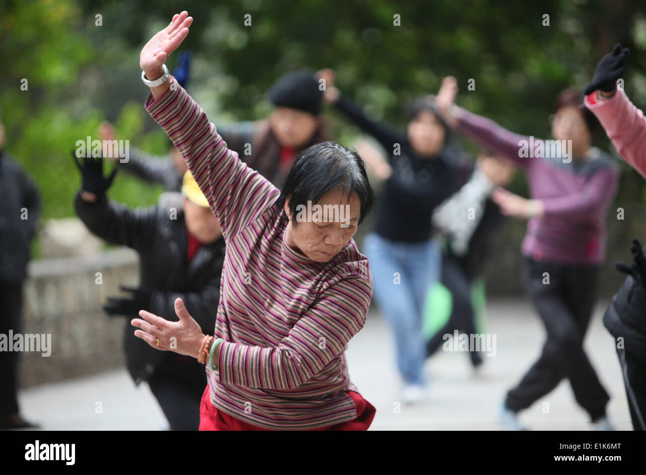 Morning tai-chi exercises in a park Stock Photo - Alamy