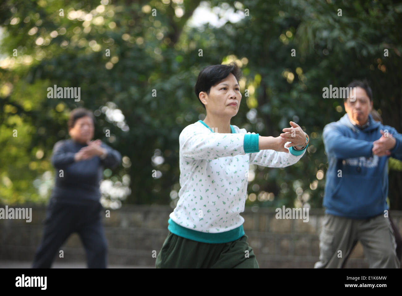 Morning tai-chi exercises in a park Stock Photo - Alamy