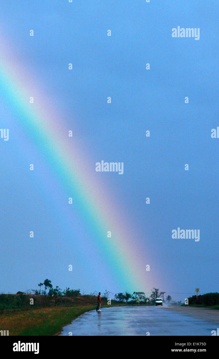 Rainbow over a road Stock Photo - Alamy