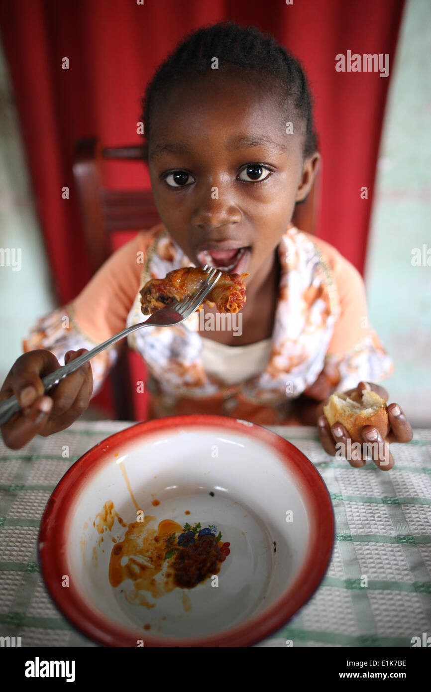 African girl eating at home Stock Photo - Alamy
