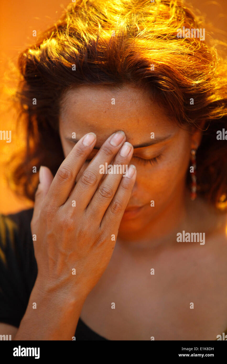 Woman praying, sign of the cross Stock Photo - Alamy