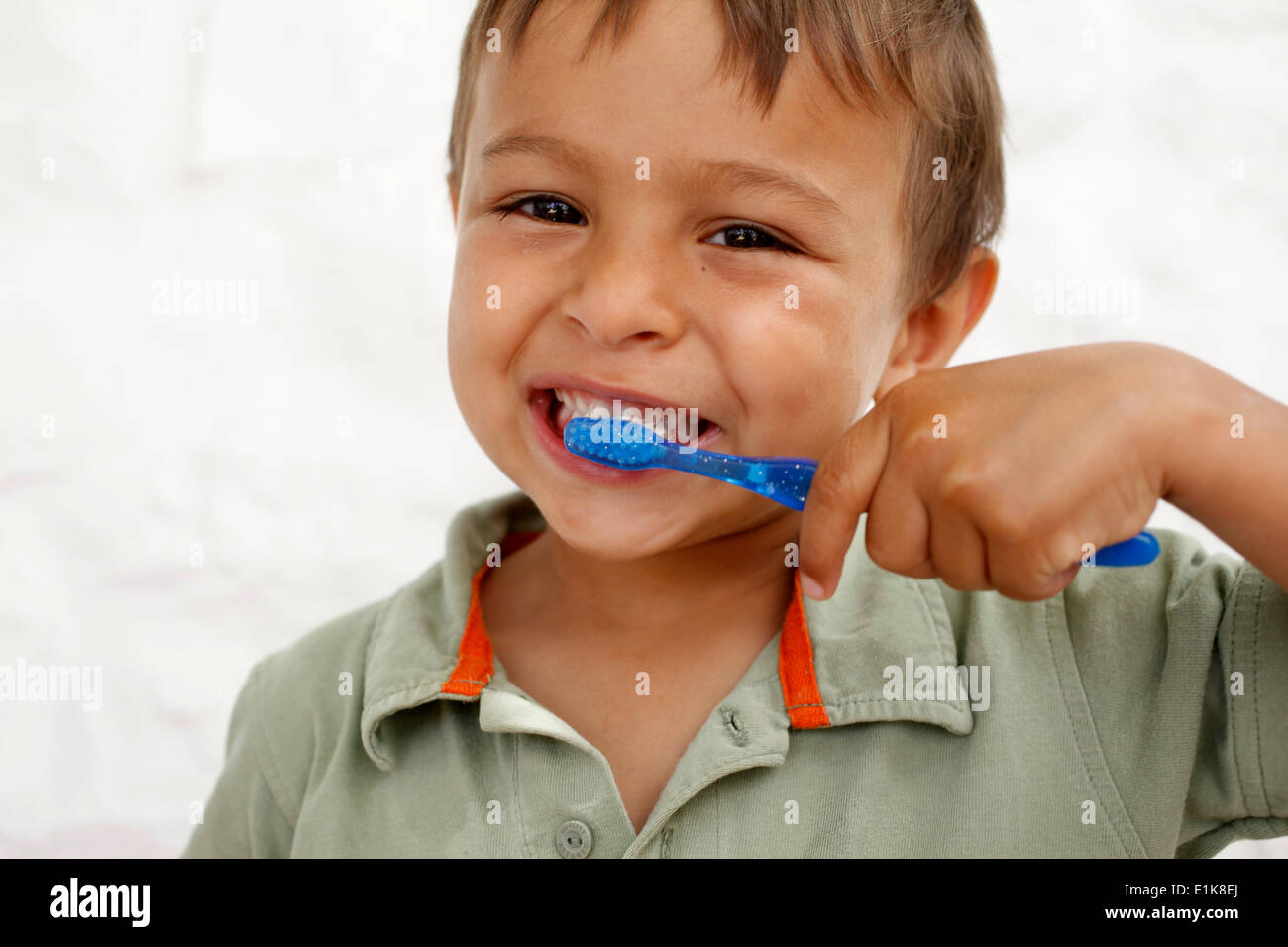 Young boy brushing teeth Stock Photo - Alamy