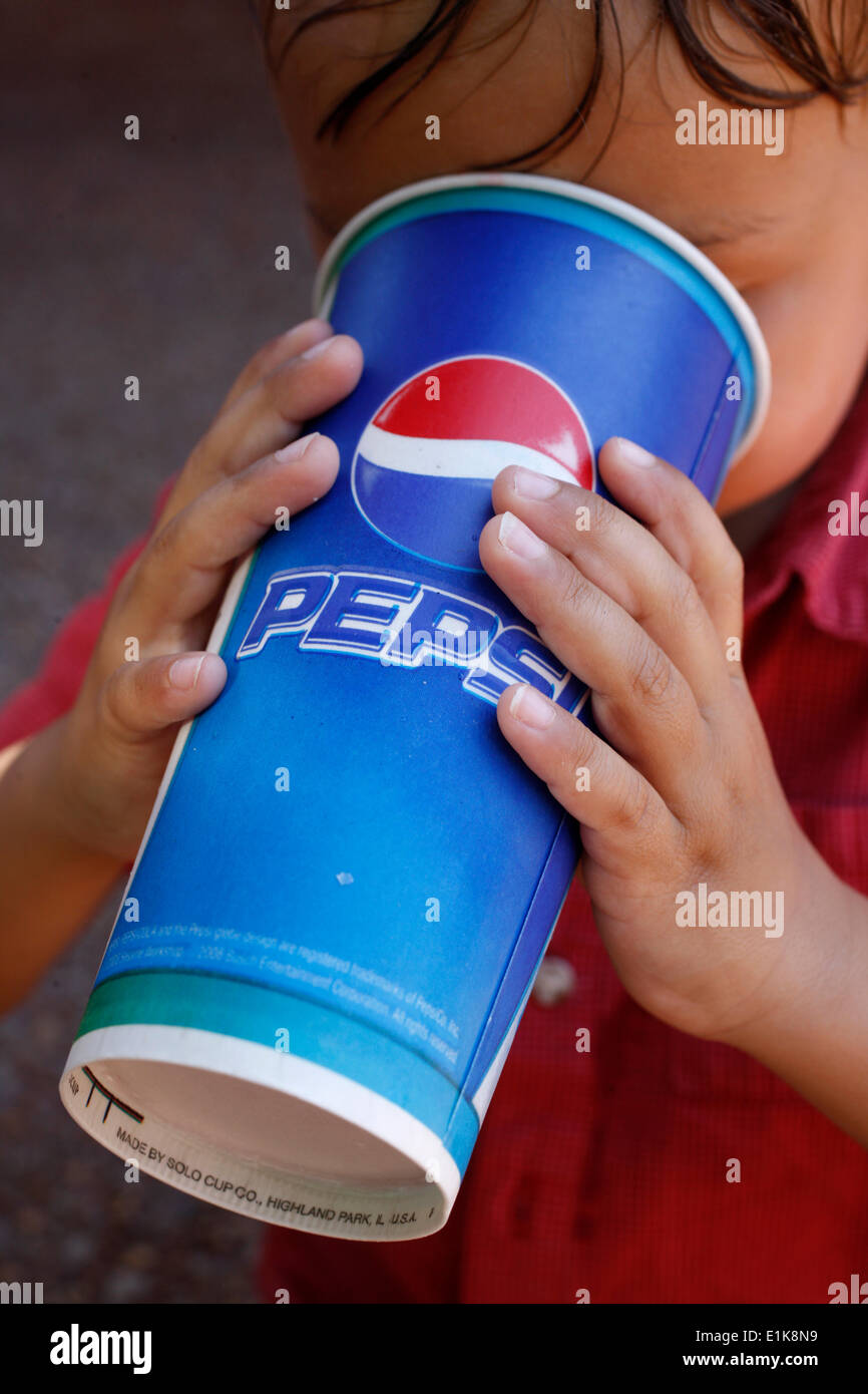 Boy drinking a large soft drink Stock Photo - Alamy