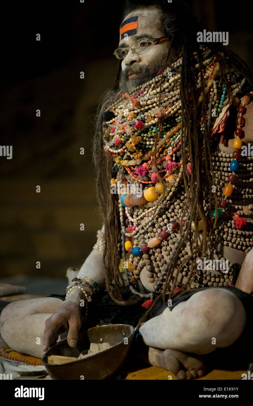 Lali Baba, a priest in Varanasi, waiting for worshipers that he will ...