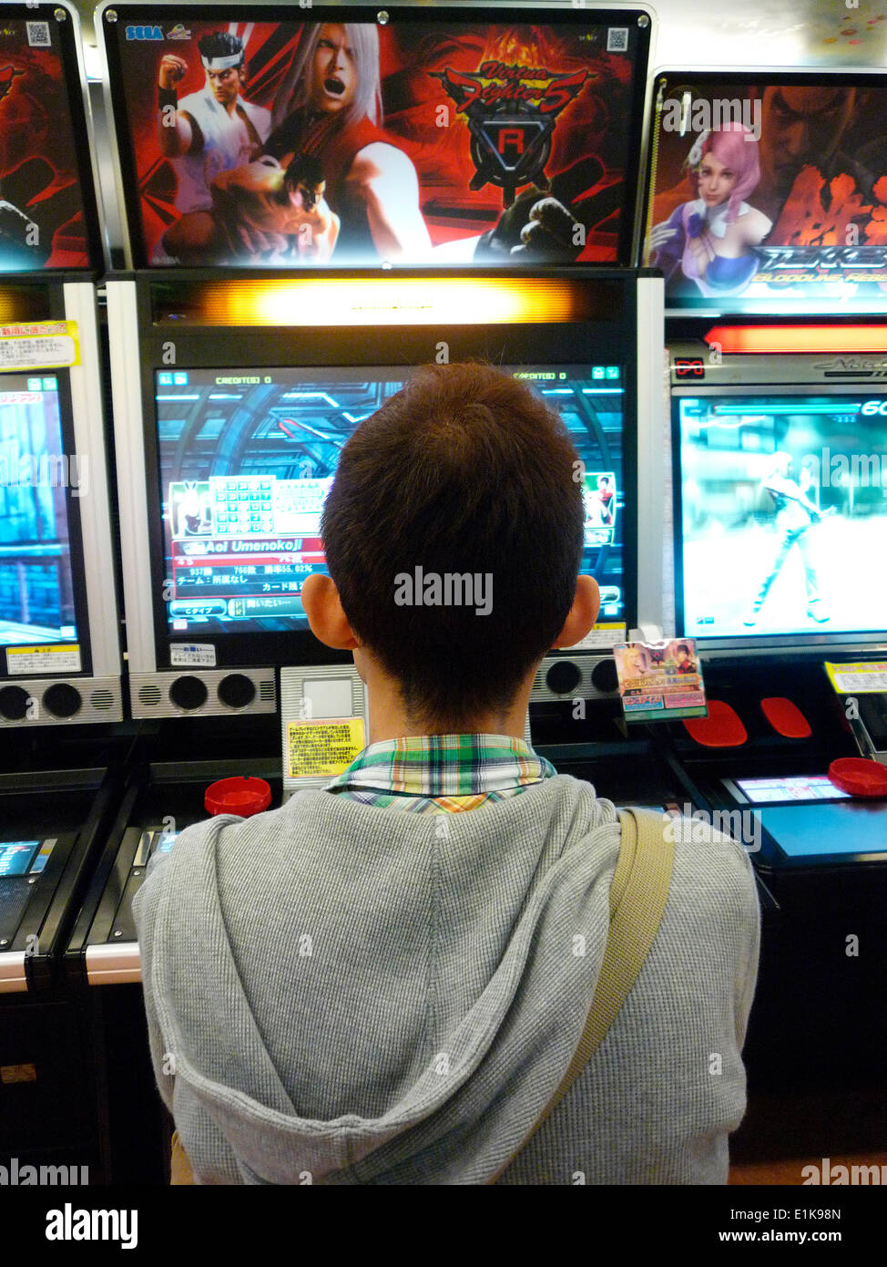 Teenager playing a japanese video game hi-res stock photography and ...