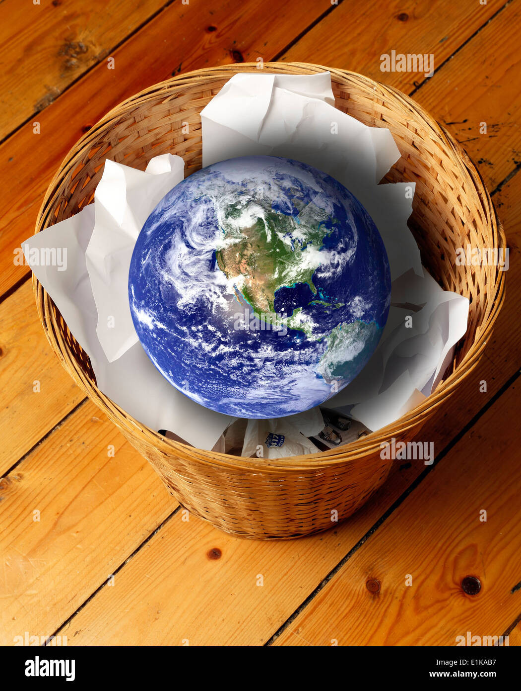 Computer artwork of planet Earth in the bin Stock Photo - Alamy