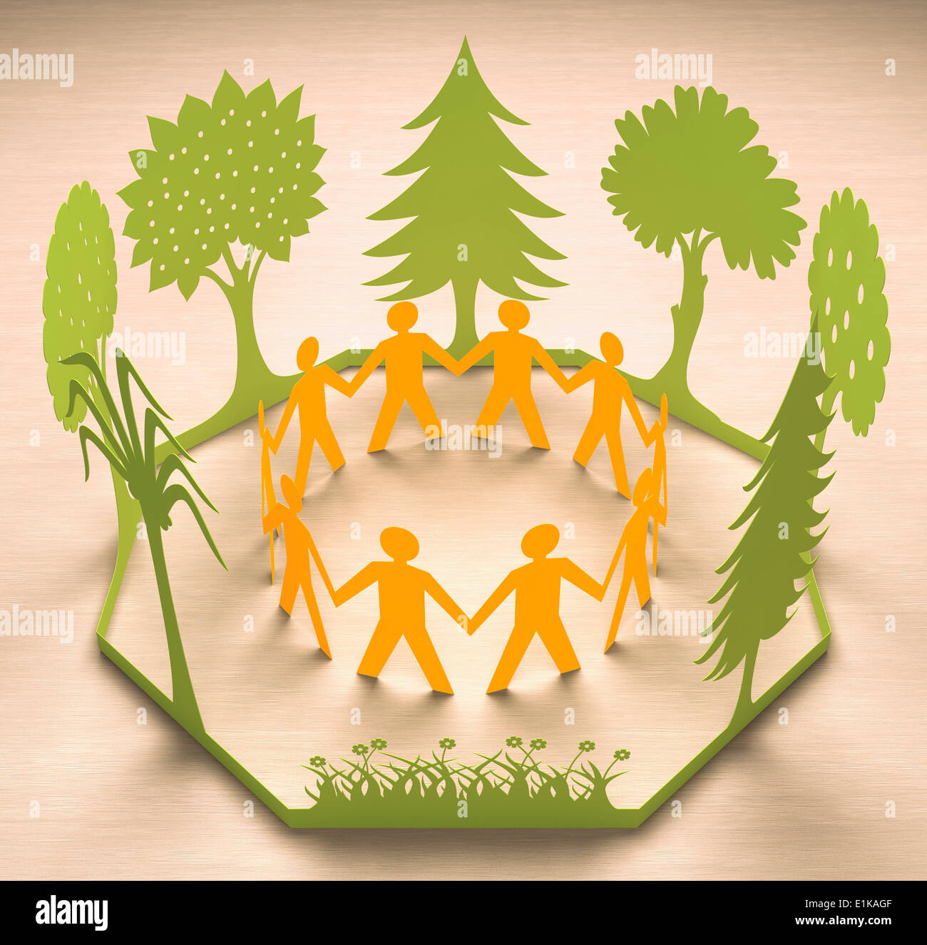 Paper chain of people holding hands with trees studio shot Stock Photo ...