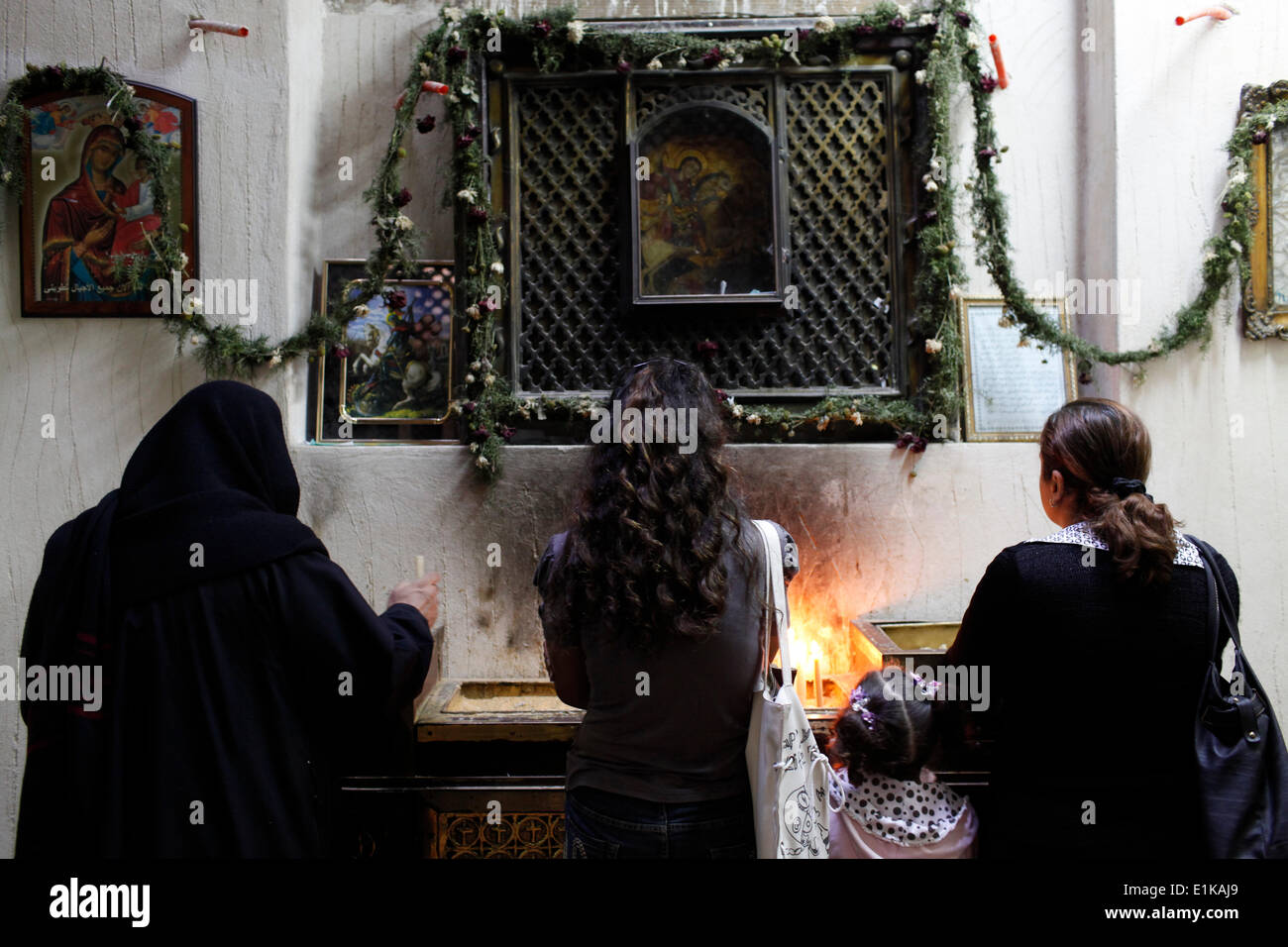 Women praying in Saint George coptic orthodox church Stock Photo - Alamy