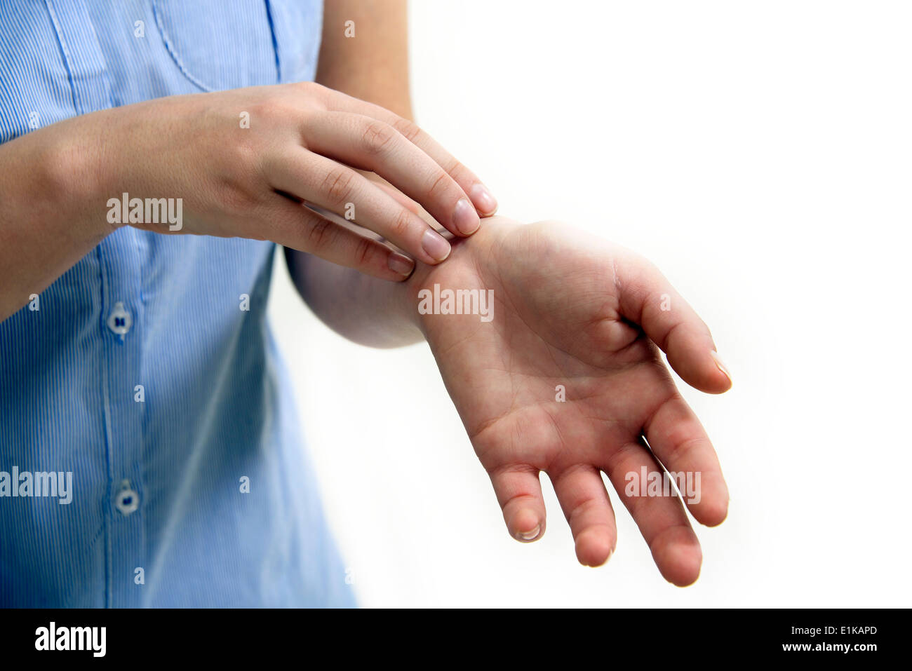 MODEL RELEASED Teenage girl scratching wrist Stock Photo - Alamy