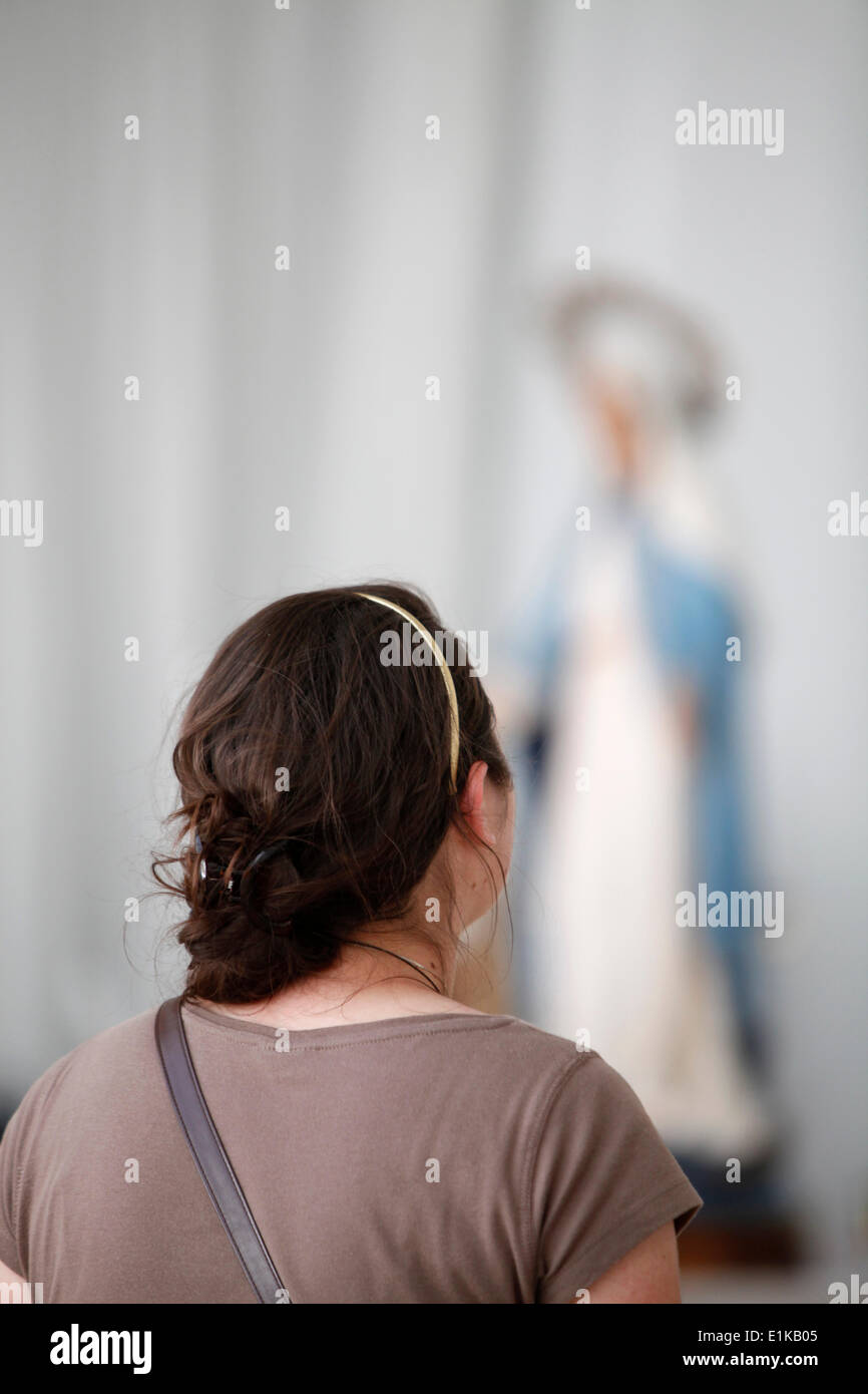Praying pilgrim at World Youth Day Stock Photo - Alamy