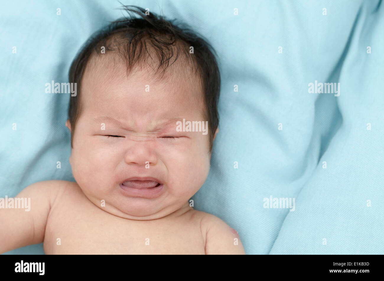 MODEL RELEASED Baby girl crying Stock Photo - Alamy