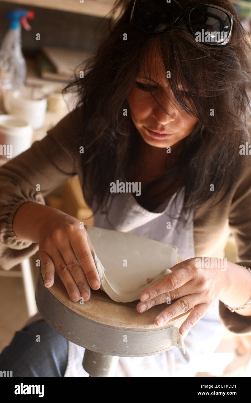 Woman doing pottery Stock Photo - Alamy