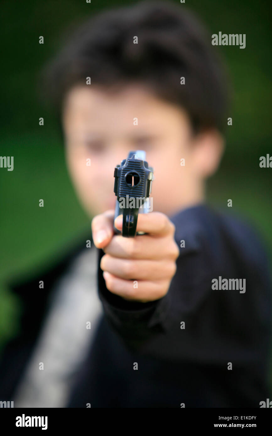 Boy with toy gun Stock Photo - Alamy