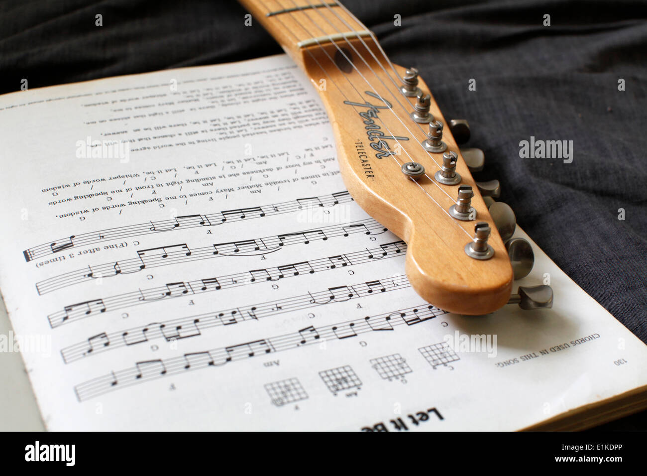 Guitar and music score Stock Photo - Alamy