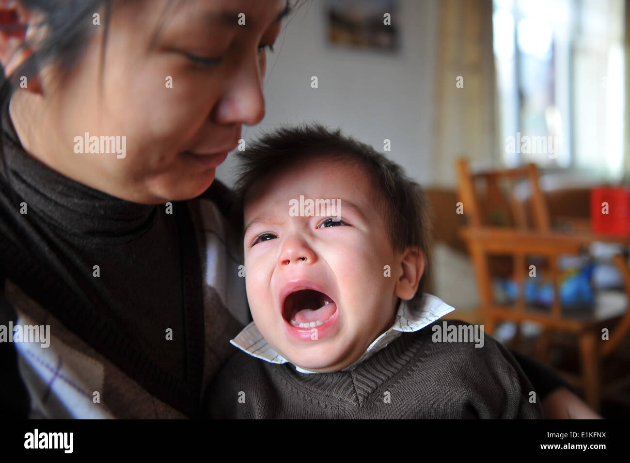 Mother and crying son Stock Photo - Alamy